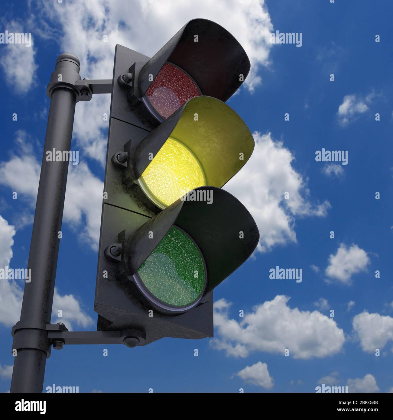 Traffic Light in a blue sky with only the yellow light on Stock Photo ...