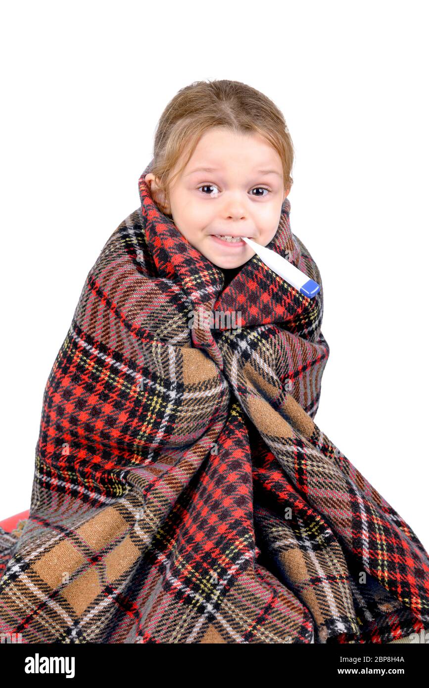 Young girl with a cold wrapped in a blanket with a termometer Stock ...