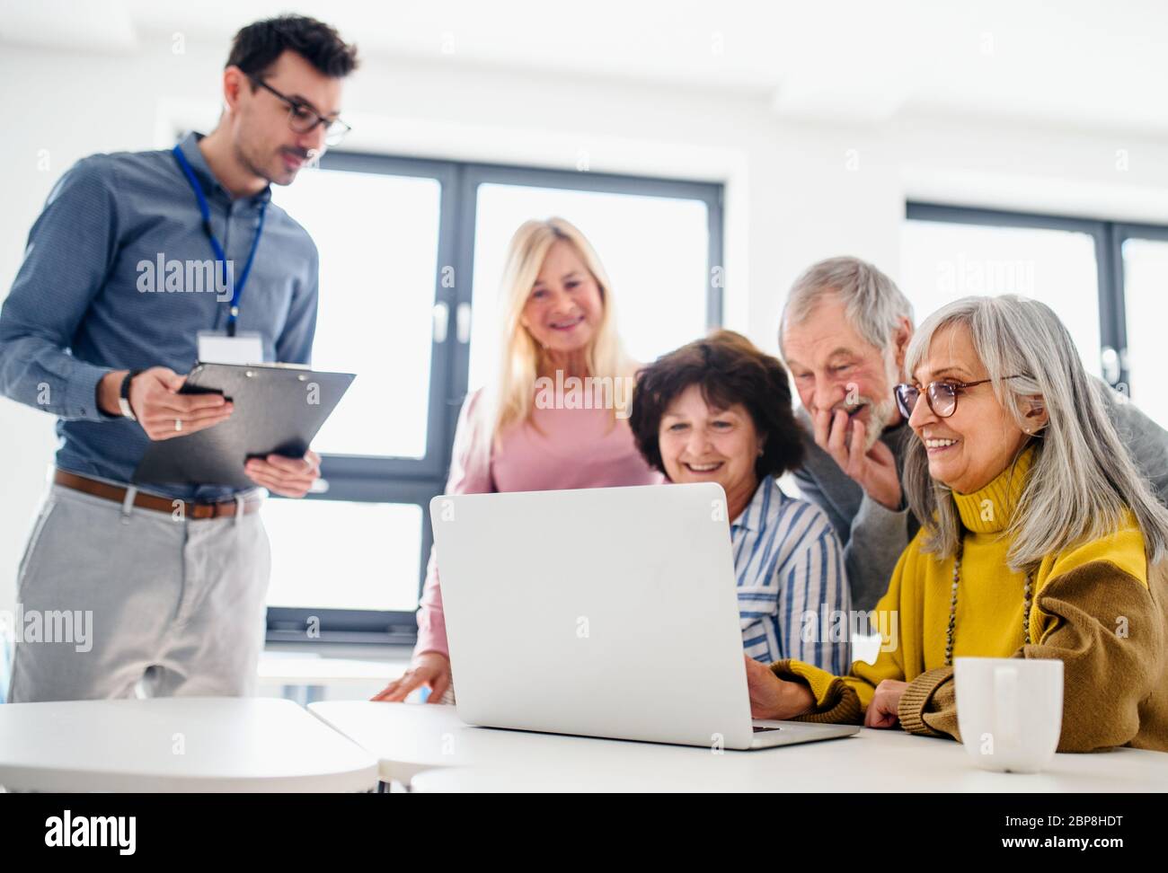 Group of senior people attending computer and technology education ...