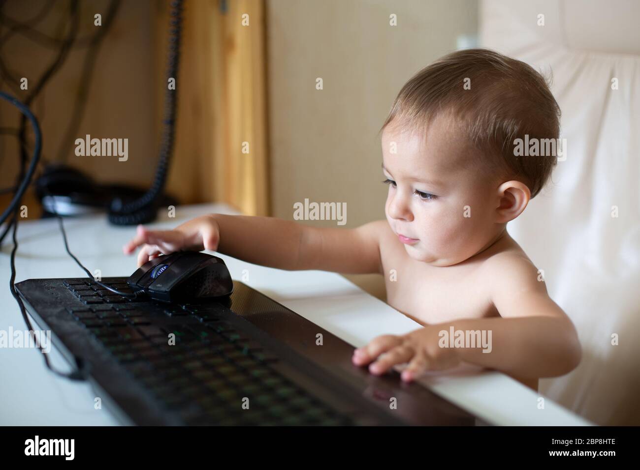concept of safety internet for children. cute little baby sitting on an ...