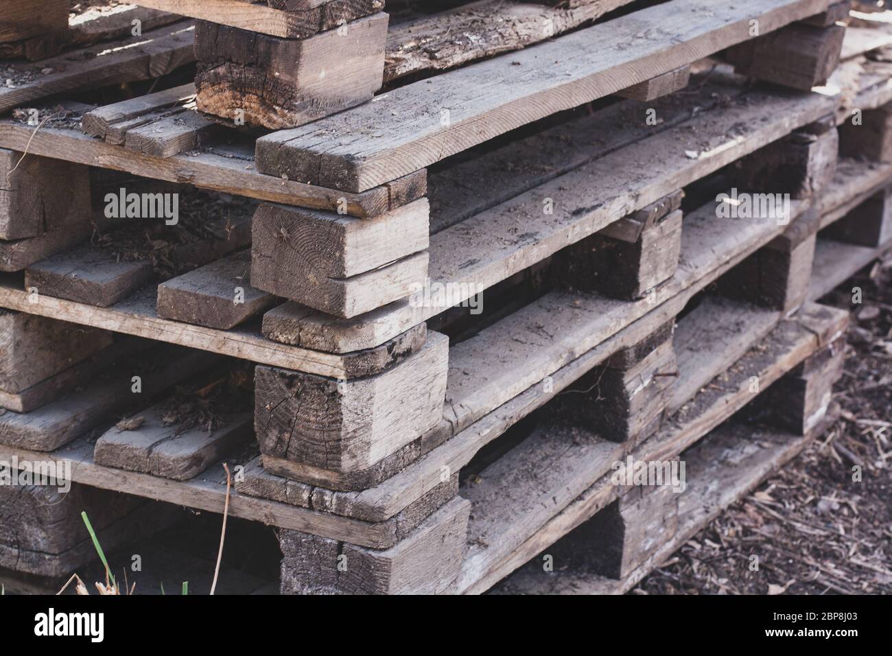 Old pallets are stacked. Old dirt on pallets. Tinted. Horizontal Stock ...