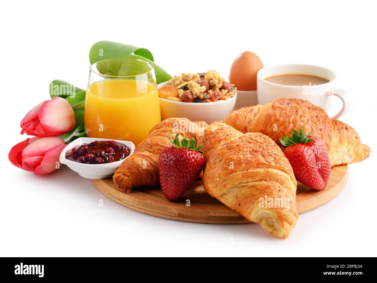 Composition with breakfast on the cutting board isolated on white Stock ...