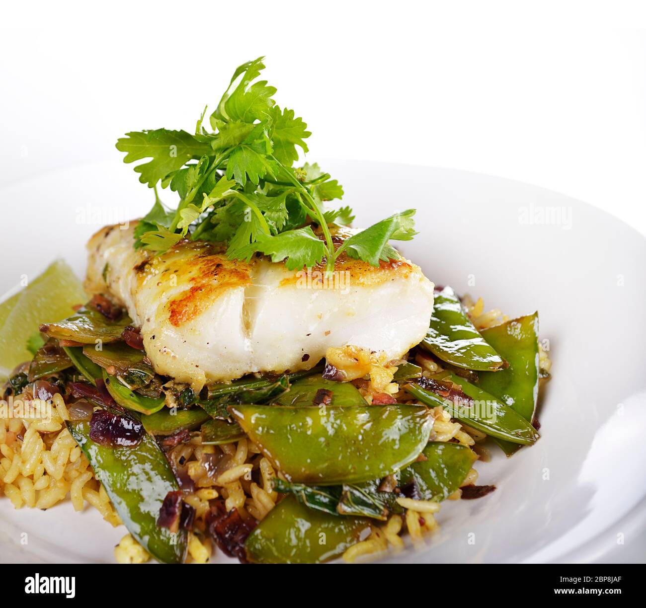 Cod Fish Fillets With Rice and Peas Stock Photo - Alamy