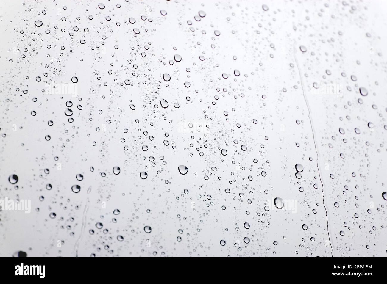 Drops of rain on the inclined window Stock Photo - Alamy