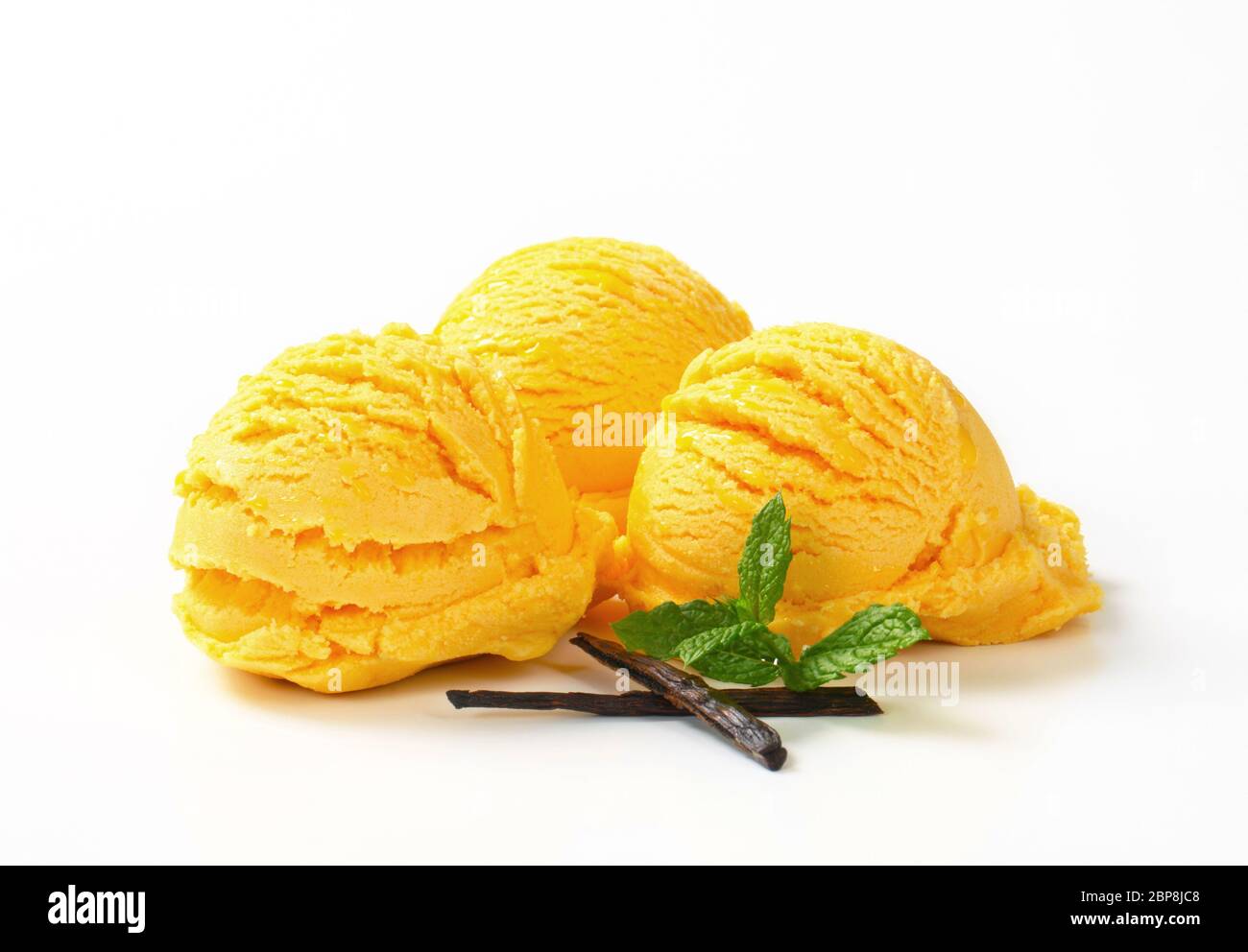 Three scoops of yellow ice cream Stock Photo - Alamy