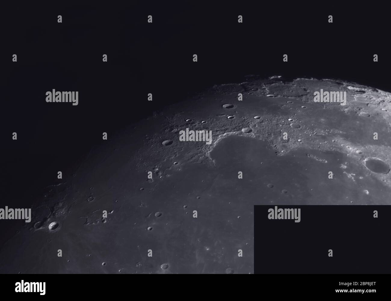 NW limb of the waxing gibbous moon with Sinus Iridum Stock Photo - Alamy