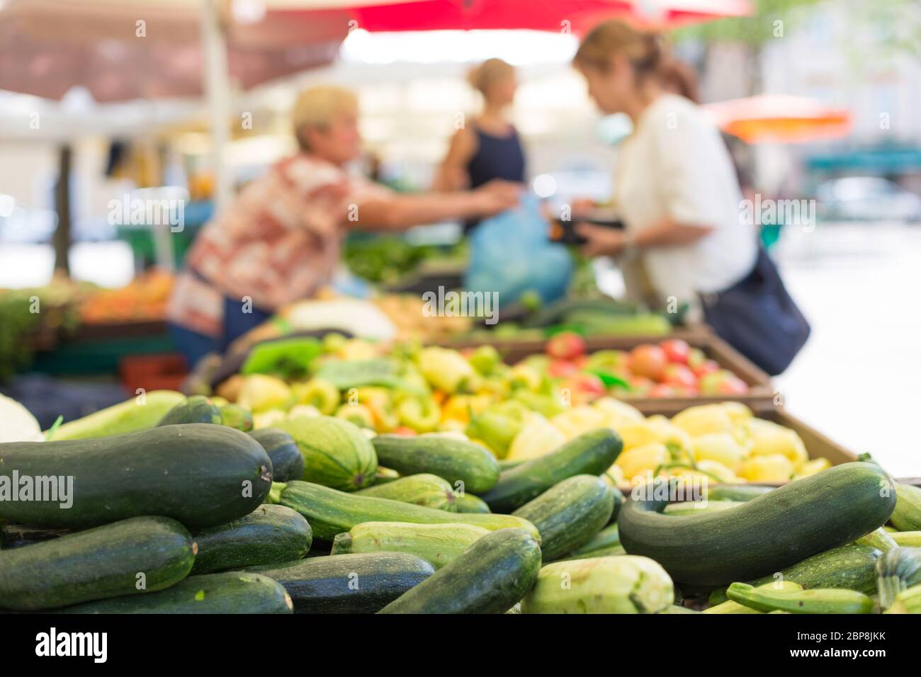 Farmers' food market stall with variety of organic vegetable. Vendor ...