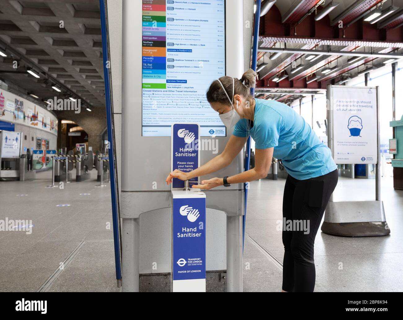 Commuters using hand sanitiser points at Waterloo Underground station ...
