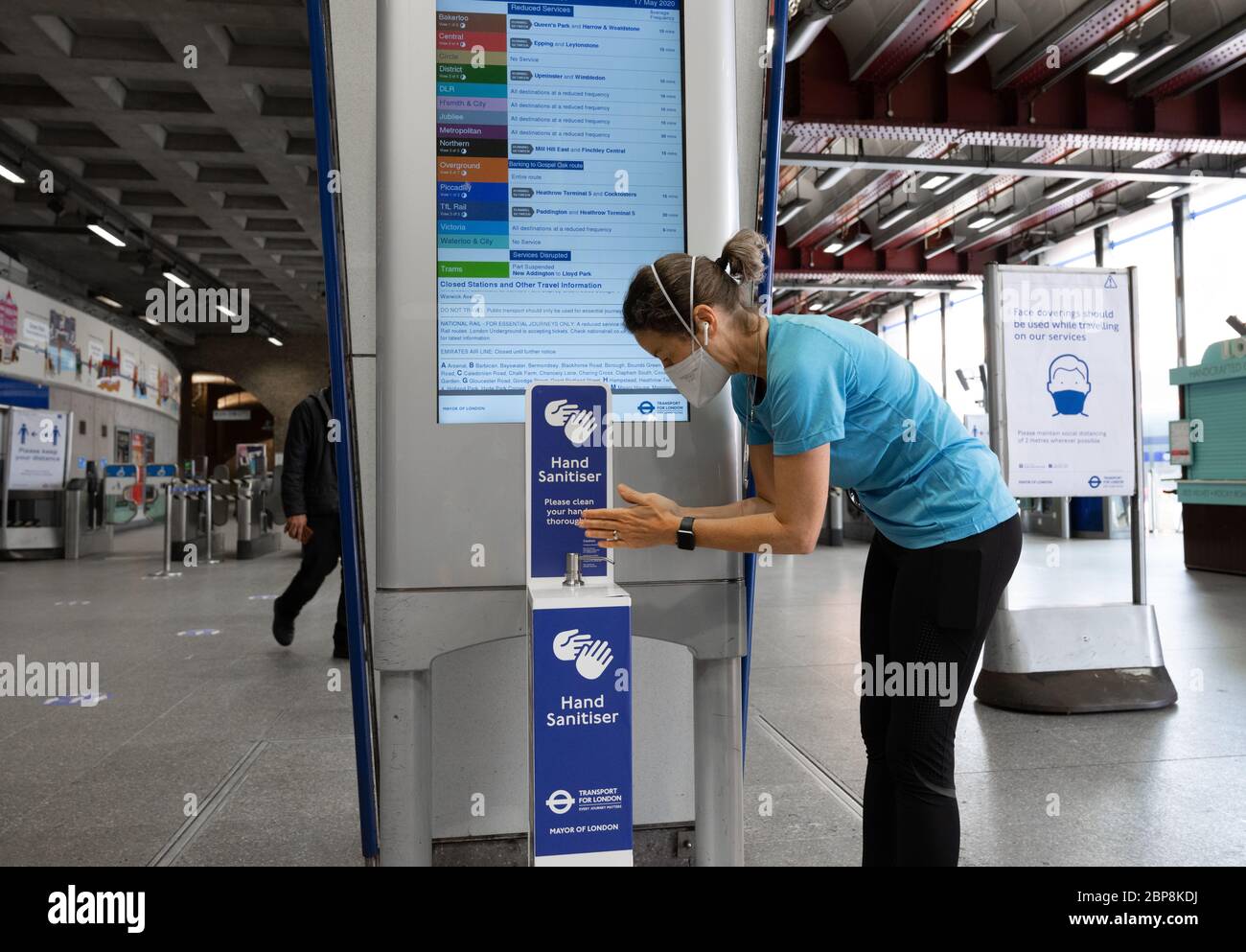 Commuters using hand sanitiser points at Waterloo Underground station ...