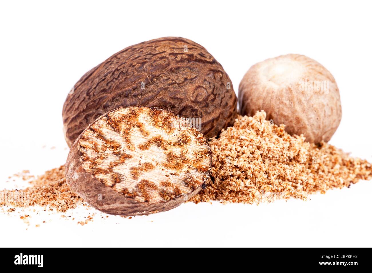 Nutmeg , whole, half and ground isolated on white background, close up ...