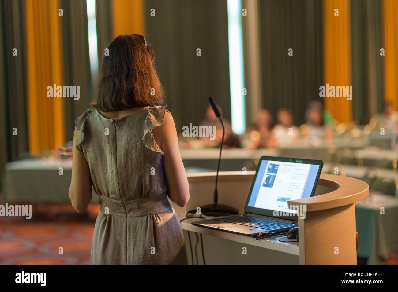Female speaker at Business Conference and Presentation. Audience at the ...