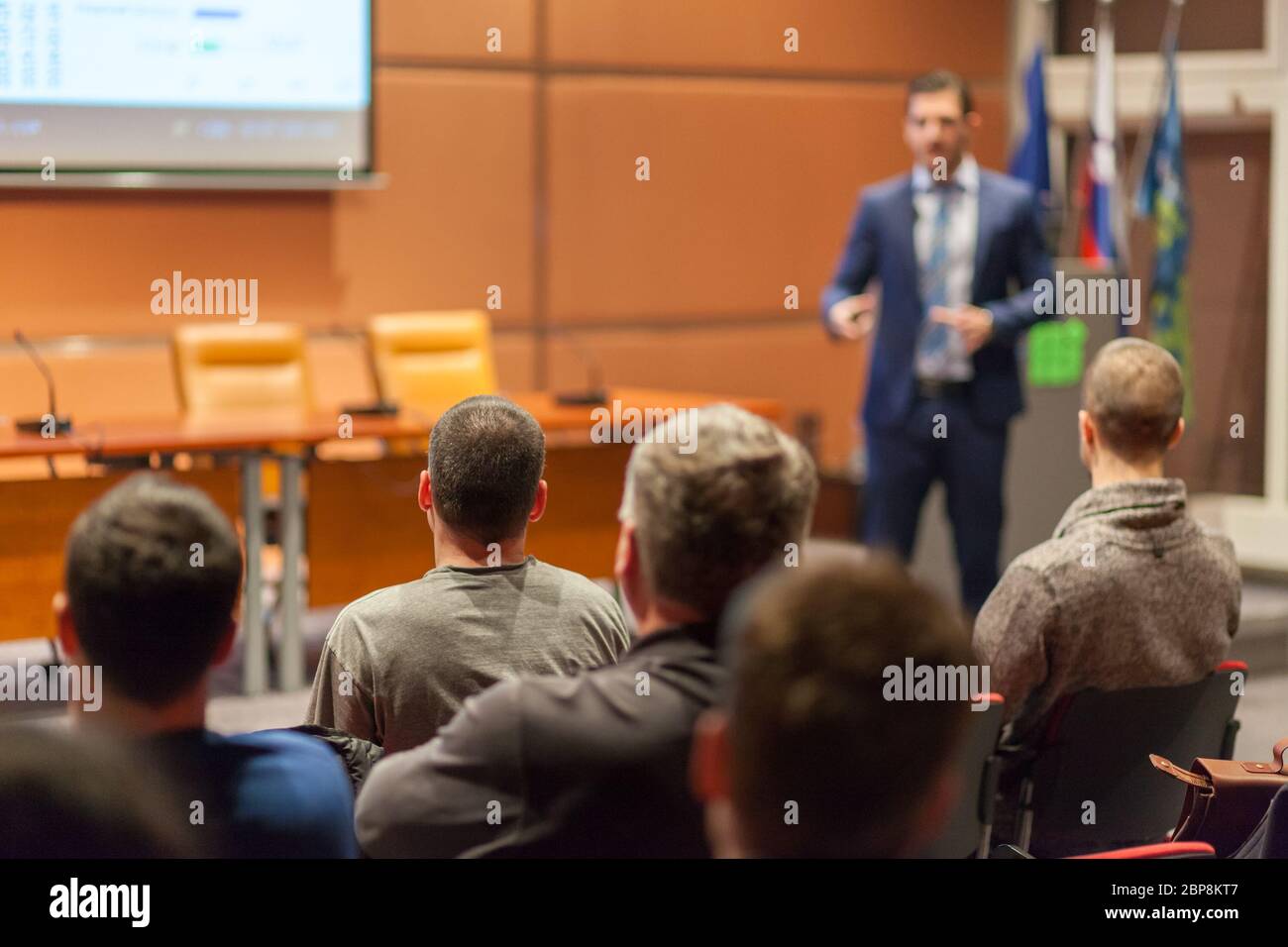 Speaker giving a talk in conference hall at business event. Audience at ...