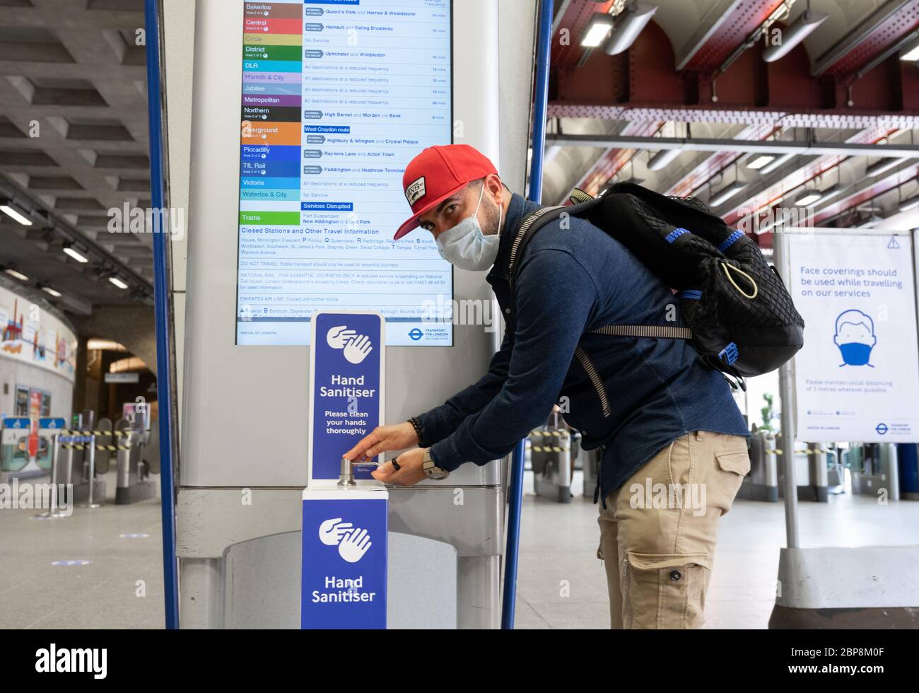 Commuters using hand sanitiser points at Waterloo Underground station ...