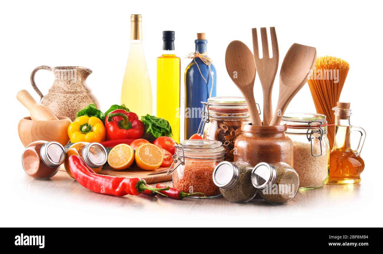 Assorted food products and kitchen utensils isolated on white ...
