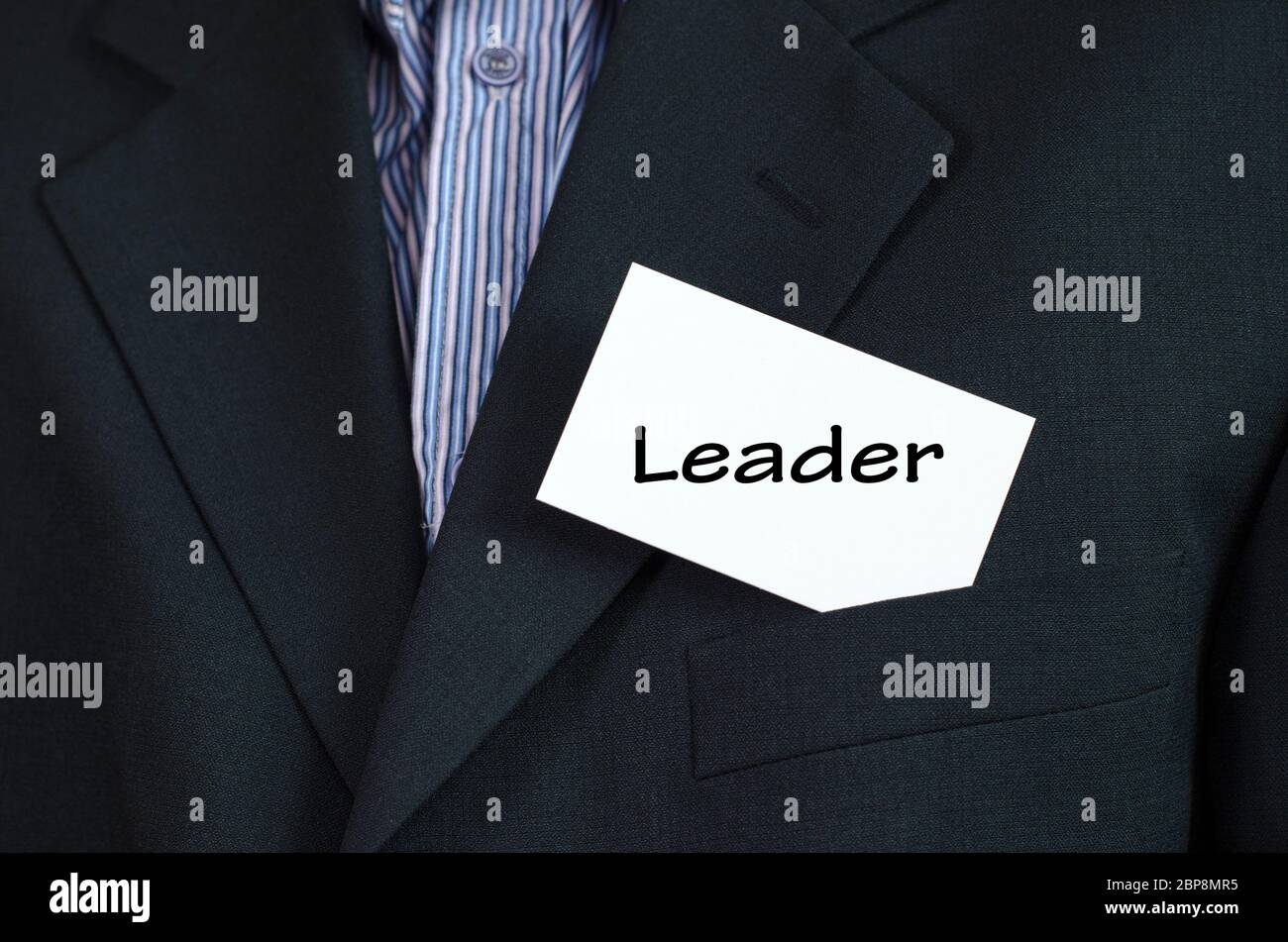 Leader text note concept over business man background Stock Photo - Alamy