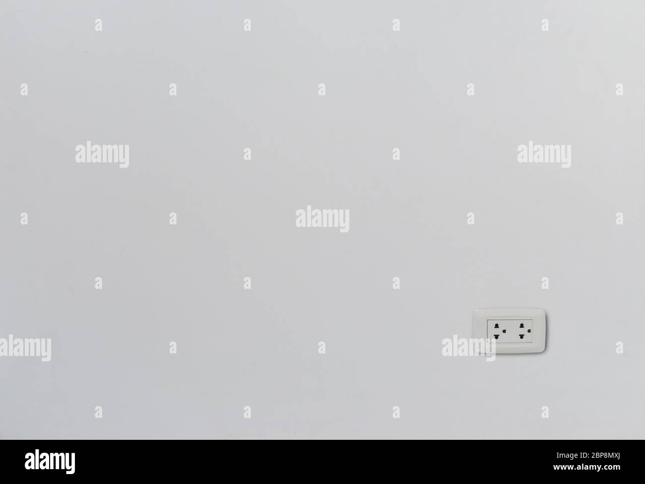 Modern thailand power outlet on white plaster wall with copy space ...