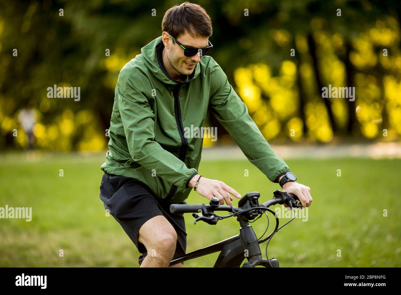 Man riding an e bike hi-res stock photography and images - Alamy