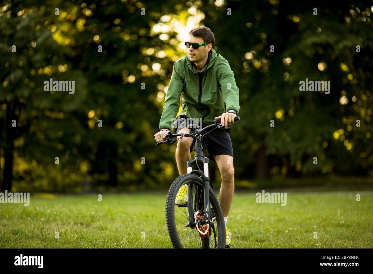 Man riding an e bike hi-res stock photography and images - Alamy