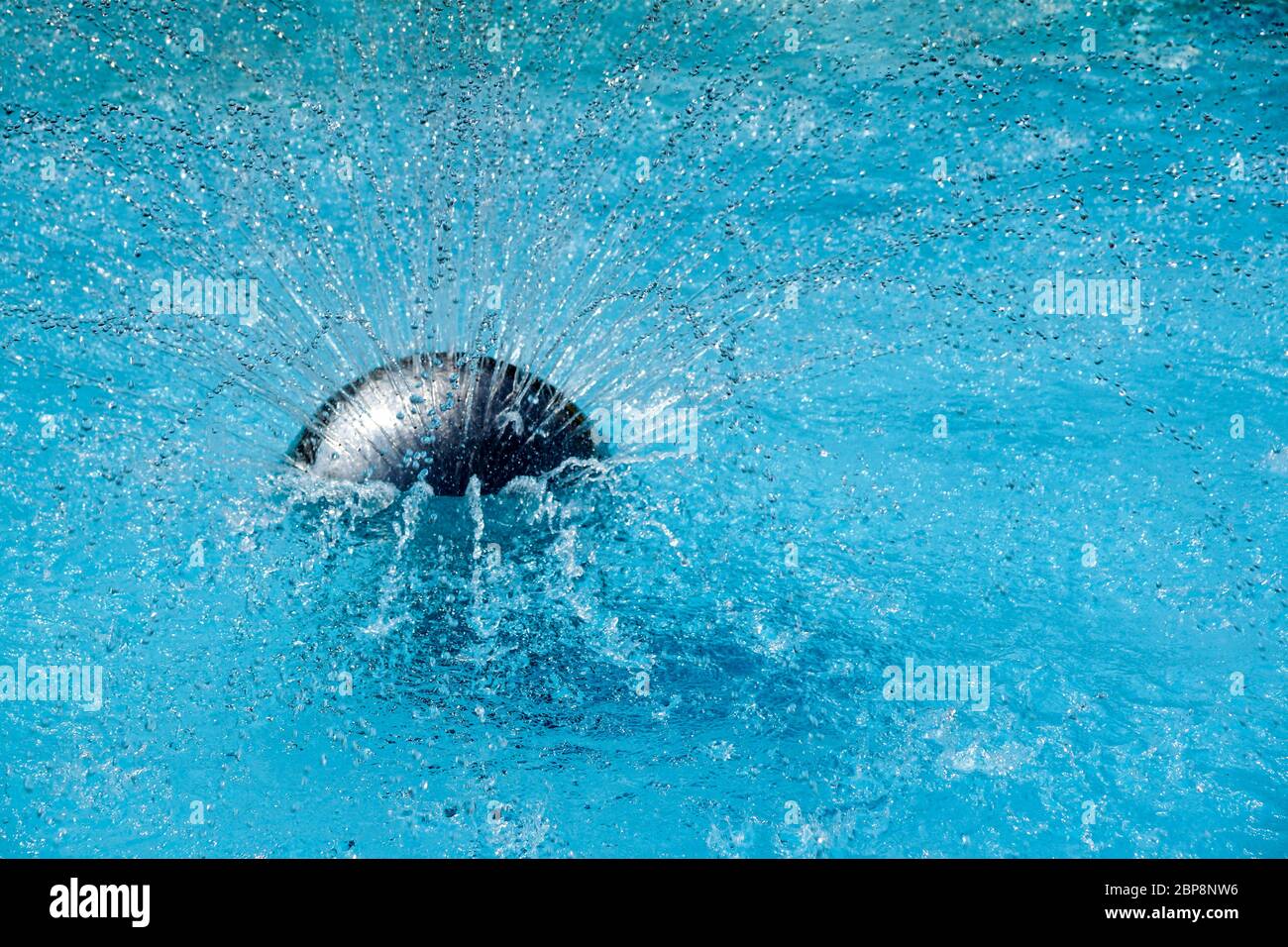 Water splashing into blue swimming pool . Fountain Stock Photo - Alamy