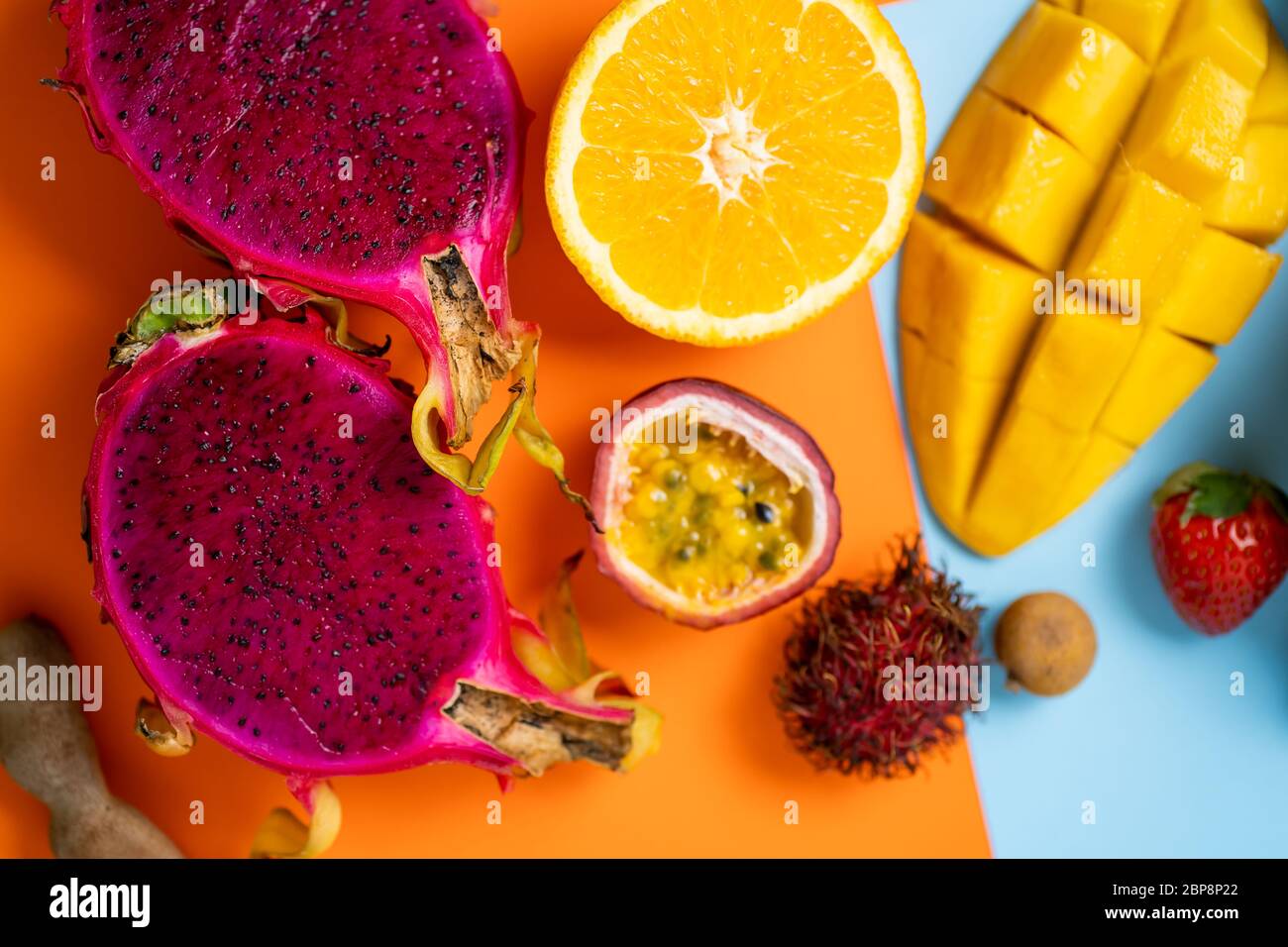 Closeup shot of halves fresh ripe exotic tropical fruits. Dragon fruit ...
