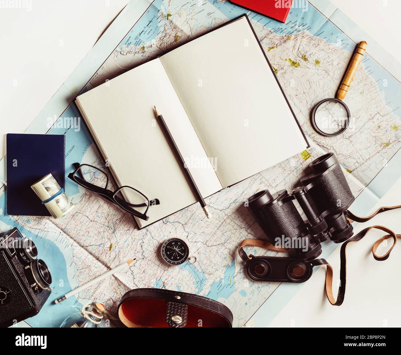 Tour planning with compass and notebook hi-res stock photography and ...