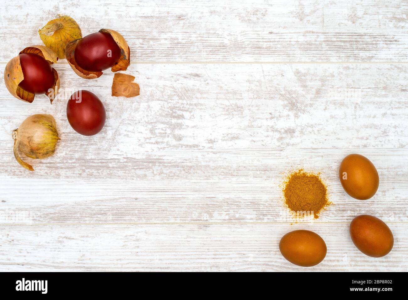 Six Easter eggs naturally dyed in onion shells and turmeric on white ...