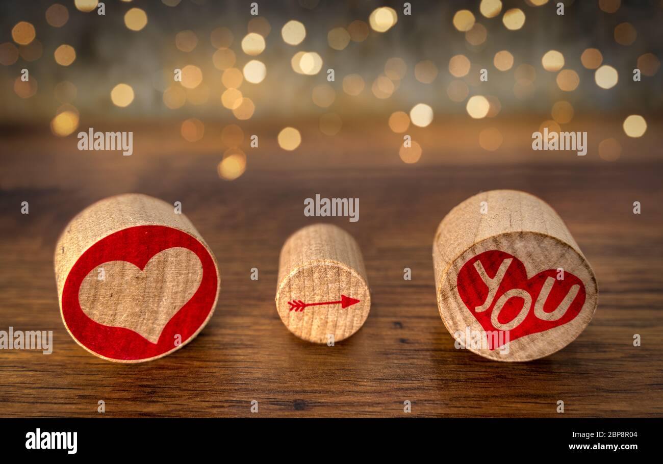 Love You sign, red hart, pointing arrow on You in red hart on oval cork ...