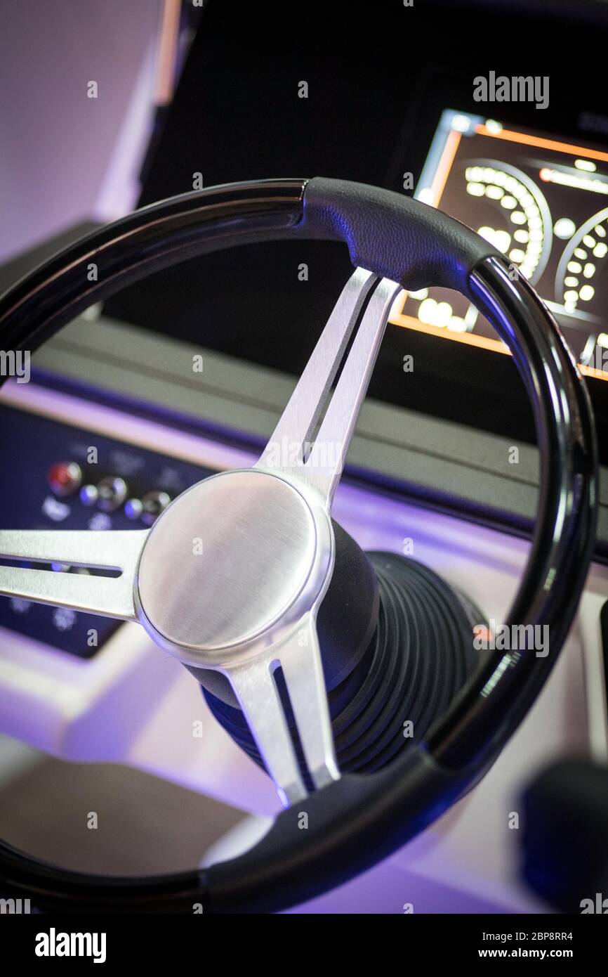 Color image of a speed boat steering wheel Stock Photo - Alamy