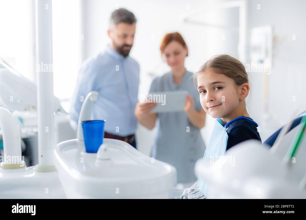 Annual dental check-up of a child with father in dentist surgery Stock Photo - Alamy
