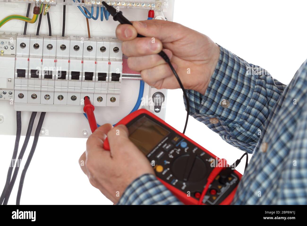 technician is testing an electrical device with instrument Stock Photo ...