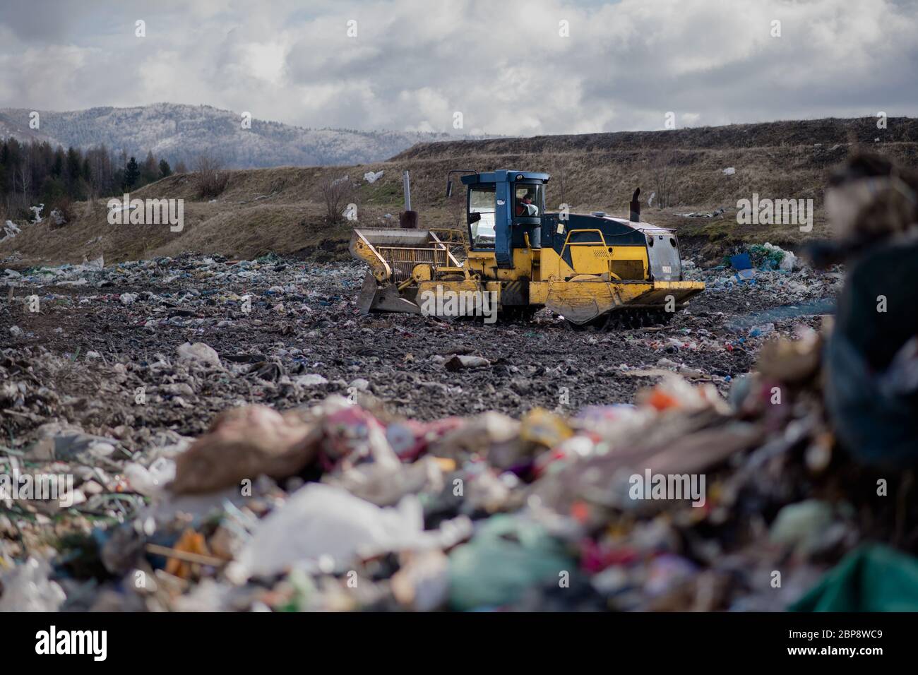 Garbage truck unloading waste on landfill, environmental concept Stock ...