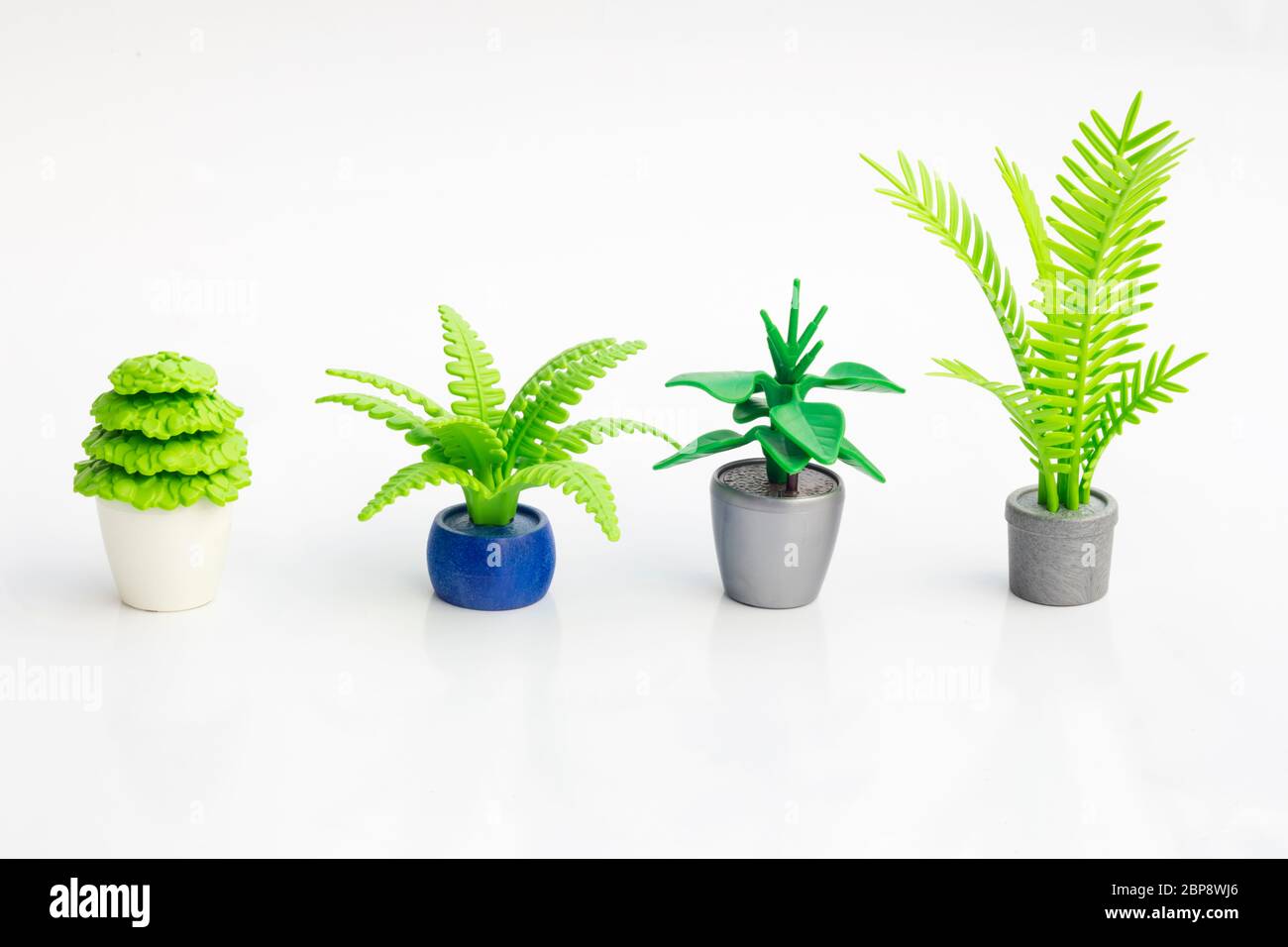 Detail of plastic toy plants in isolated white background Stock Photo ...