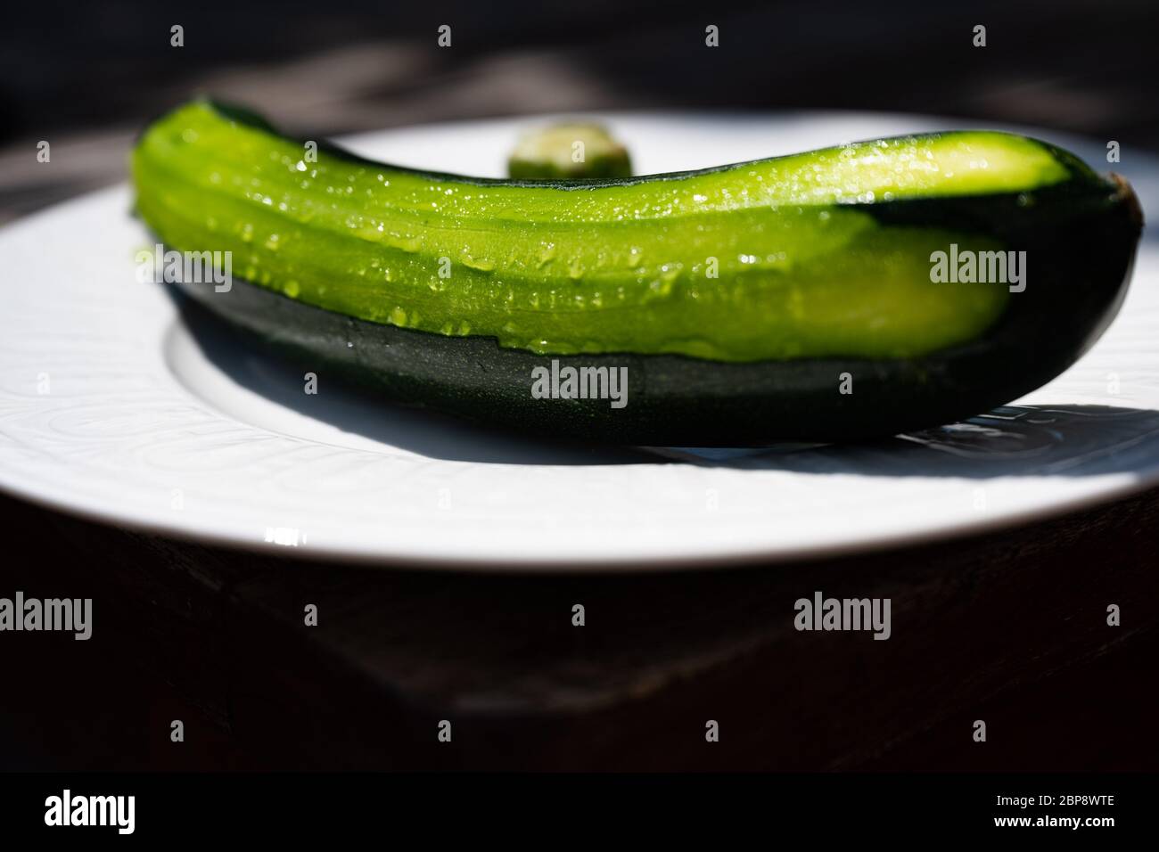 Close-up of the moisture that escapes from a freshly peeled zucchini ...