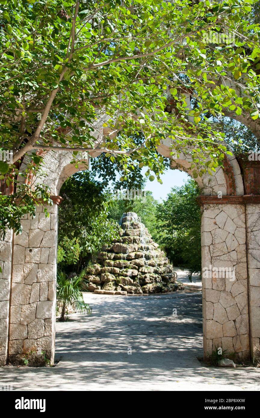 The arch structure as a park entrance and pyramid shape fountain in ...