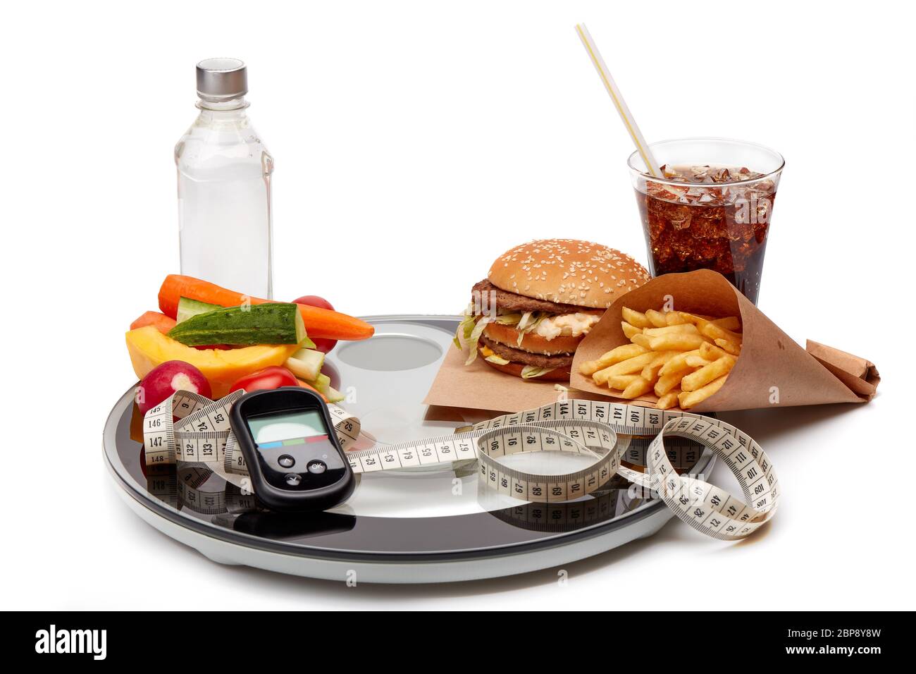 Still life with good and bad food, scales, measuring tape and blood ...