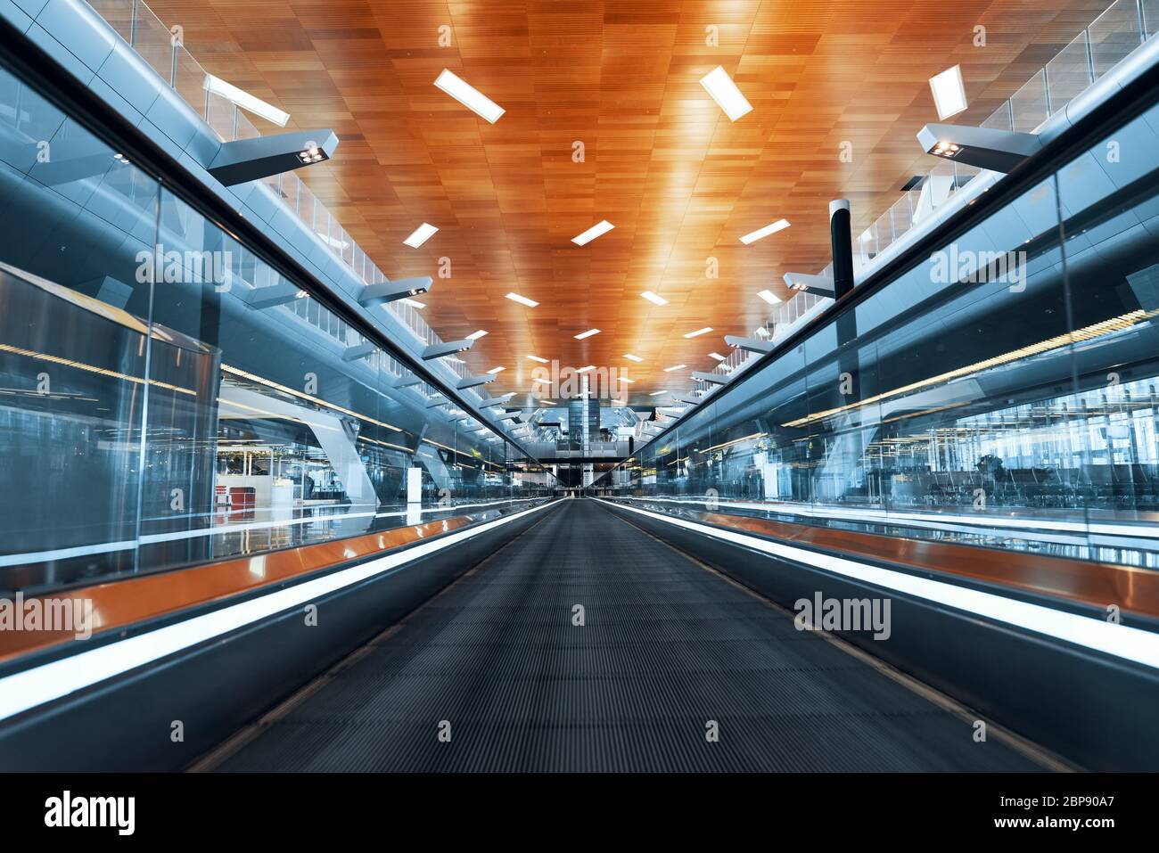 Empty moving walkway in modern shopping mall or airport. Travel ...