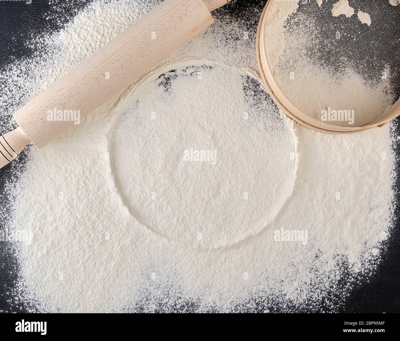 sprinkled white flour, round imprint from sieve, top view Stock Photo ...