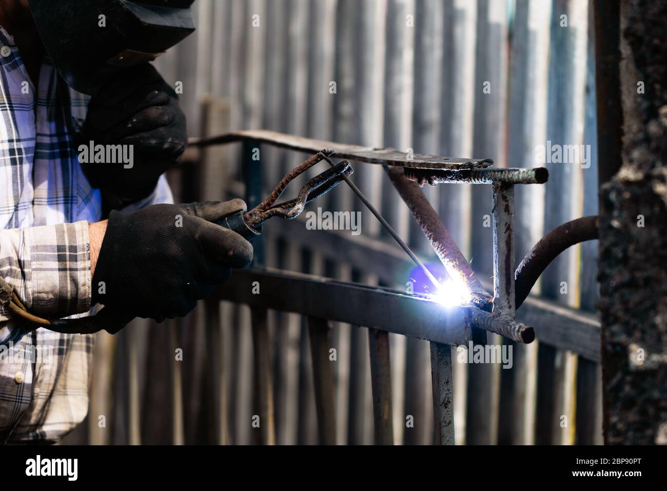 Welding metal structures at a construction site, welding a metal frame ...