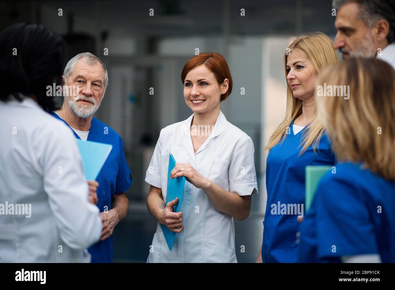 Group doctors listening medical expert hi-res stock photography and ...
