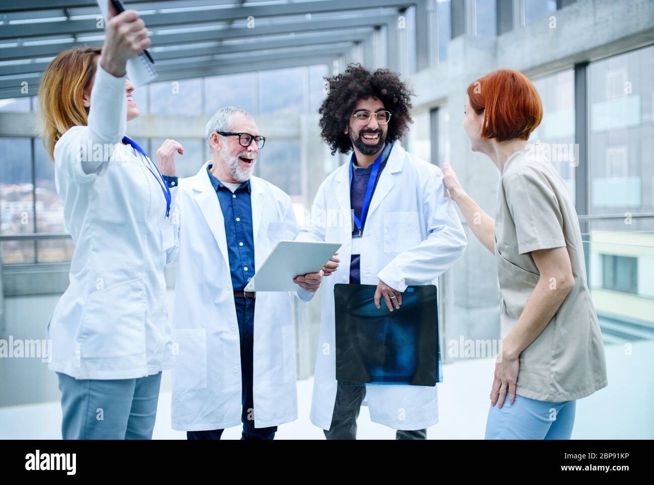 Group of doctors standing on conference, medical team laughing Stock ...
