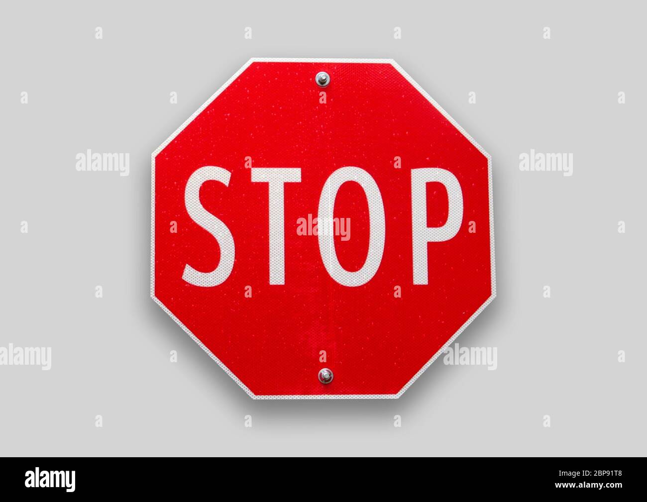 Road stop sign on an isolated gray background Stock Photo - Alamy