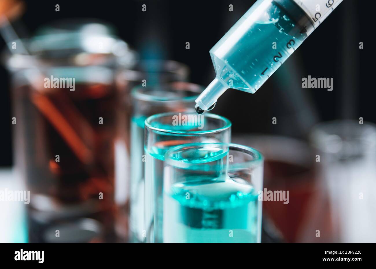 Glass laboratory chemical test tubes with liquid for analytical ...