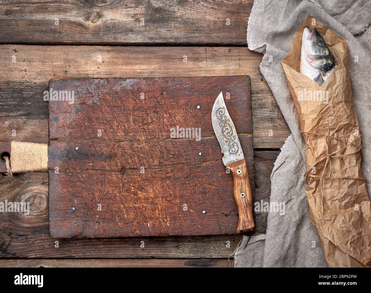 Whole fish wrapped in paper hi-res stock photography and images - Alamy