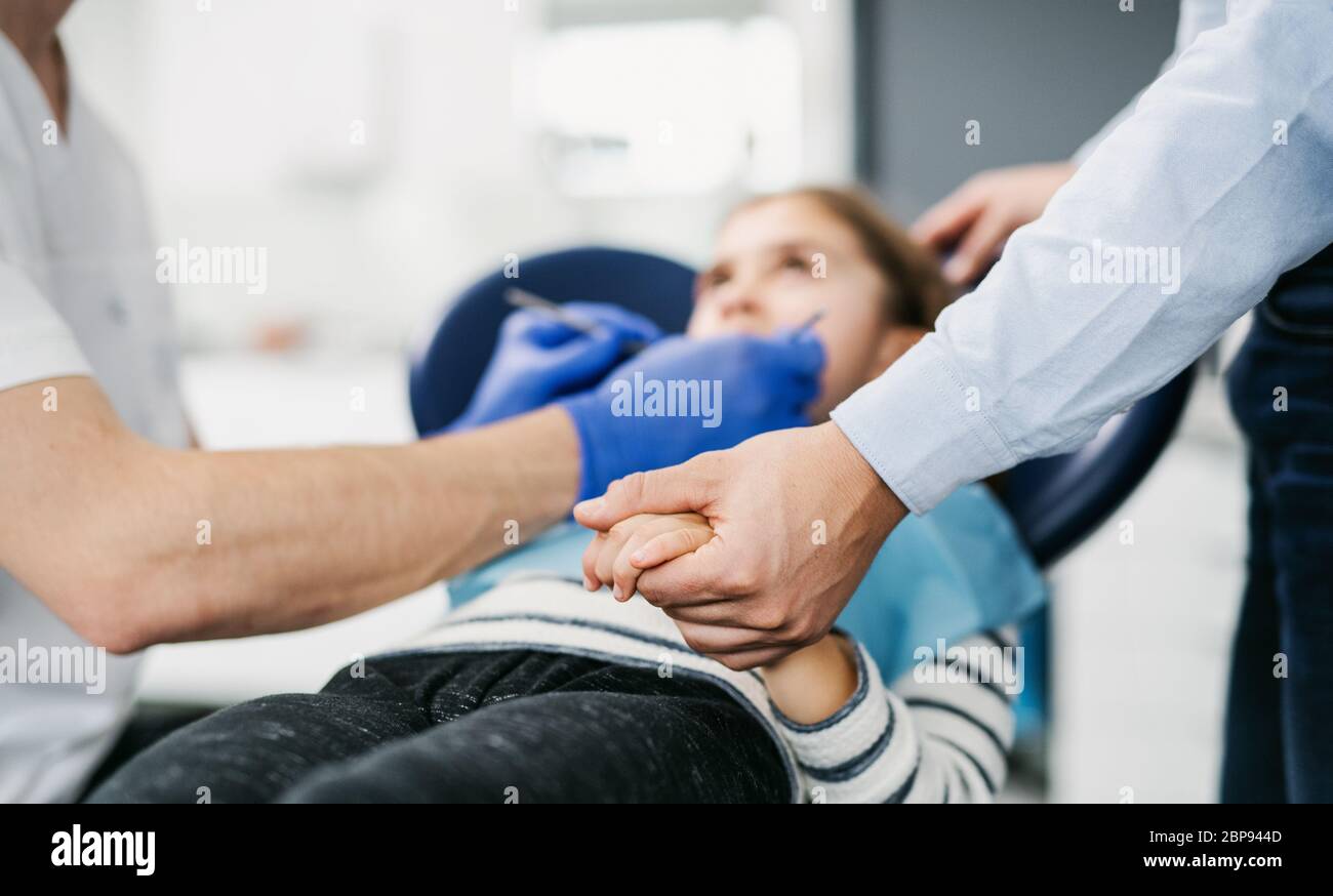 Annual dental check-up of a child with father in dentist surgery Stock Photo - Alamy
