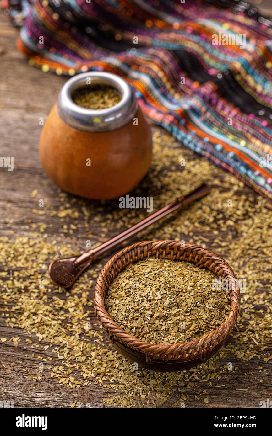Traditional South American yerba mate leaves and tea served in the ...