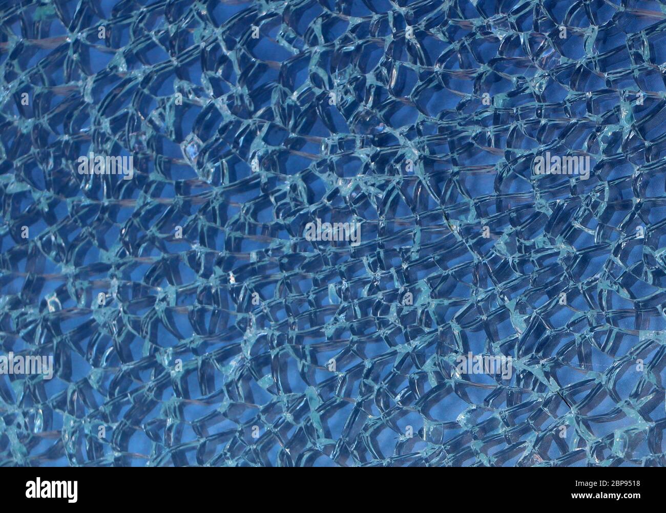 Broken shattered glass background blue Stock Photo - Alamy