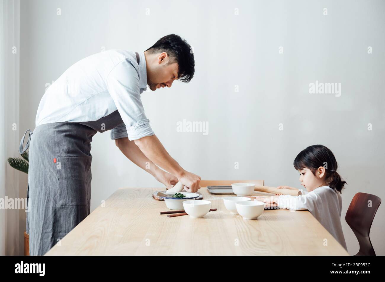 Father and daughter at home dumplings Stock Photo - Alamy
