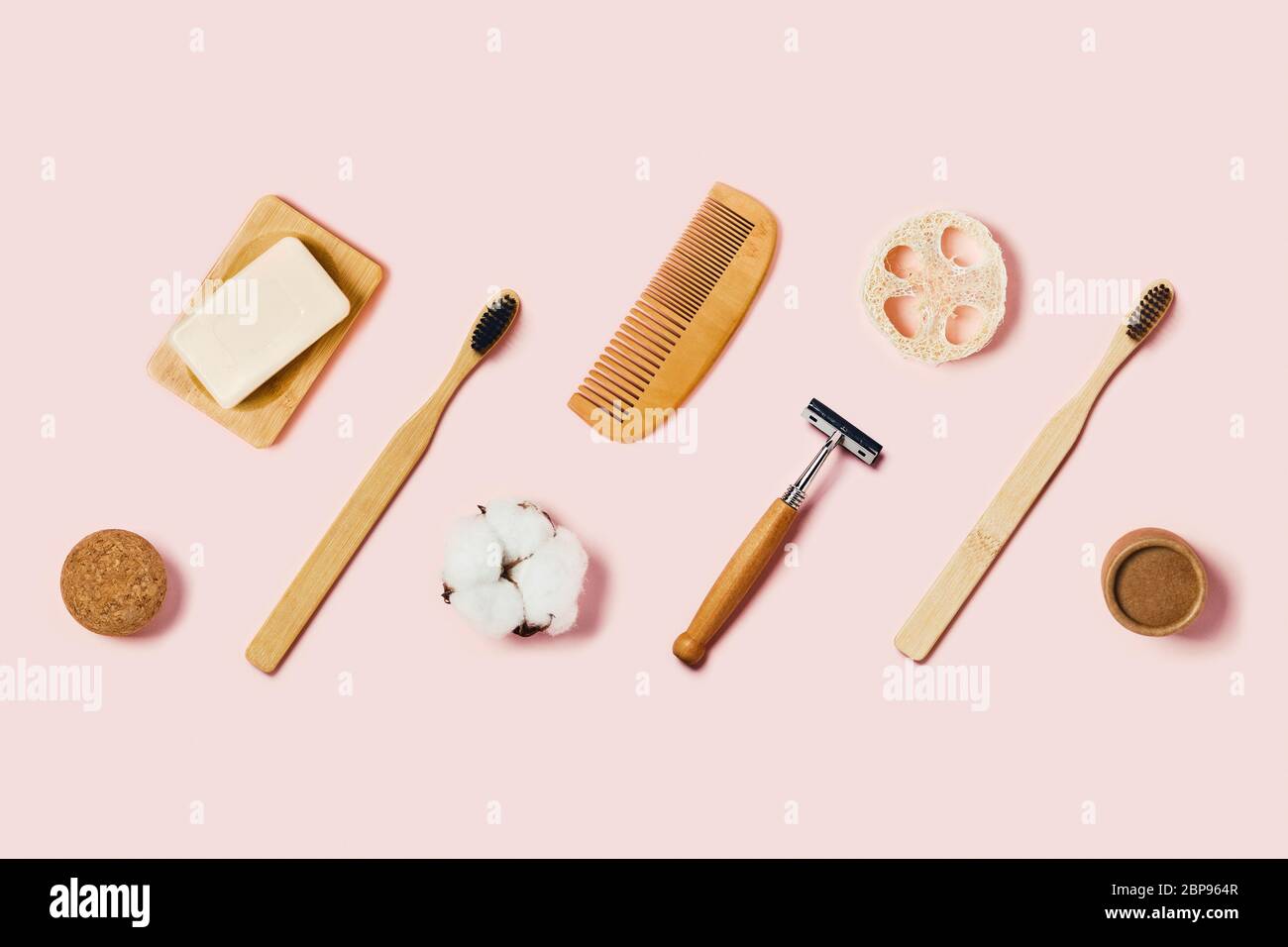 Bathroom accessories on pink background. Natural bamboo toothbrushes ...