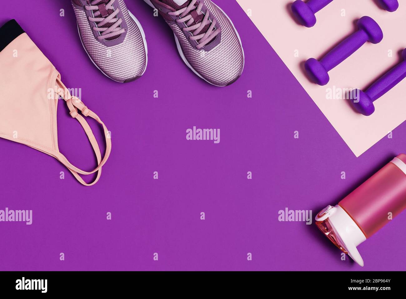 Sports equipment for training at home. Pink-purple background, diagonal ...