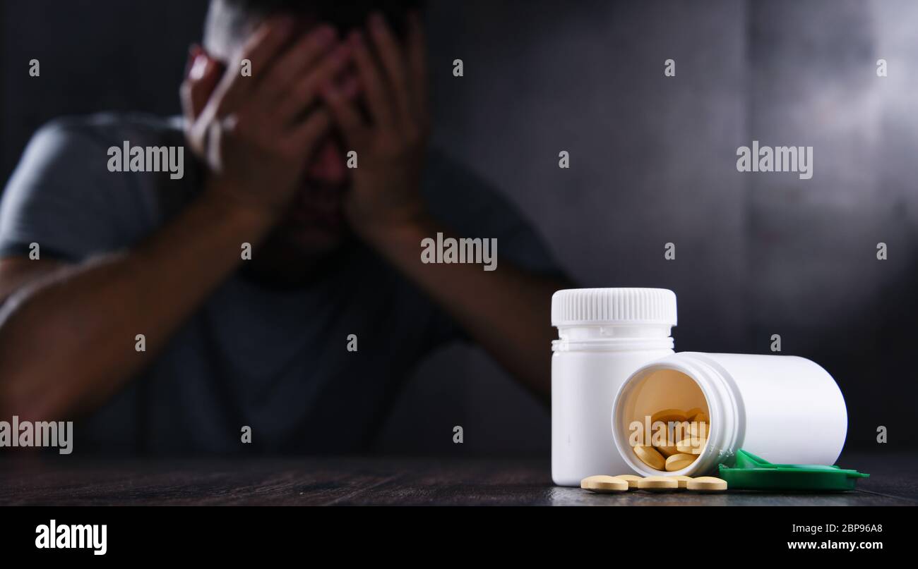 Drugs and the figure of a addicted man Stock Photo - Alamy